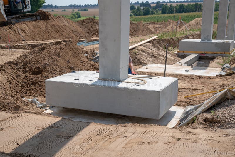 A Construction Site, Concrete Columns for a Factory Building are Placed ...