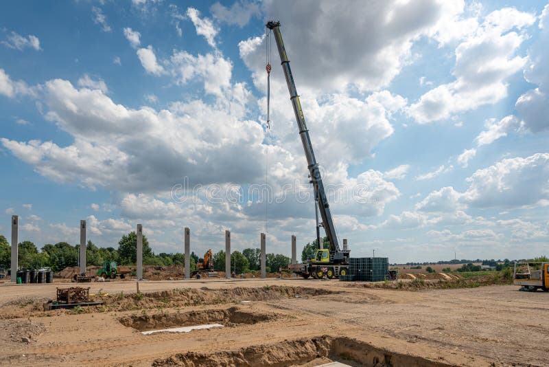 A Construction Site, Concrete Columns for a Factory Building are Placed ...