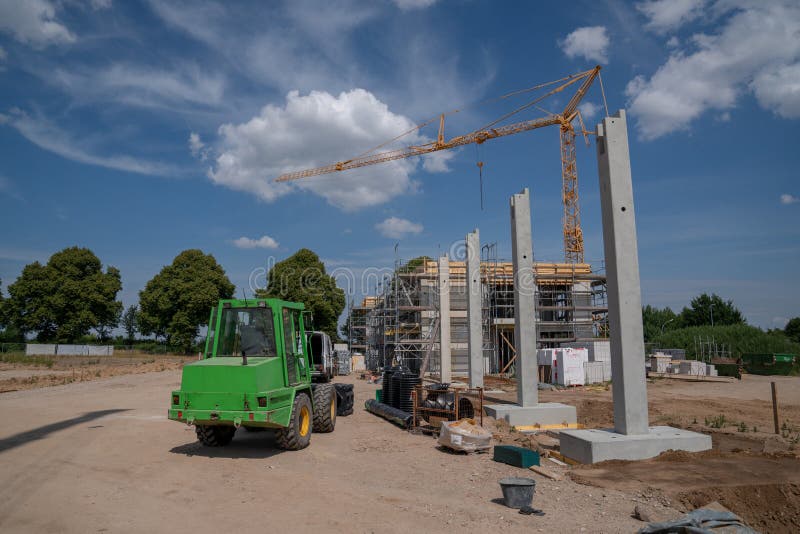A Construction Site, Concrete Columns for a Factory Building are Placed ...