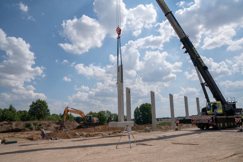 A Construction Site, Concrete Columns for a Factory Building are Placed ...