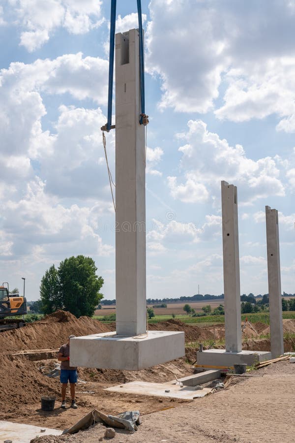 A Construction Site, Concrete Columns for a Factory Building are Placed ...