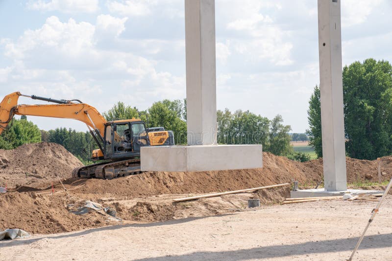A Construction Site, Concrete Columns for a Factory Building are Placed ...