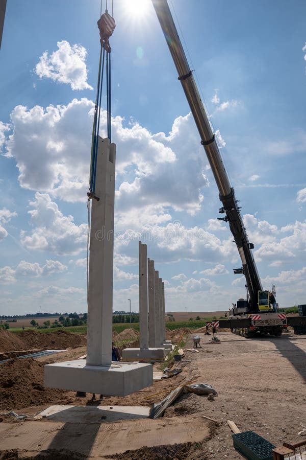 A Construction Site, Concrete Columns for a Factory Building are Placed ...