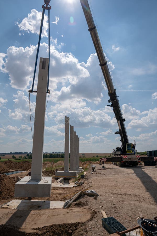 A Construction Site, Concrete Columns for a Factory Building are Placed ...
