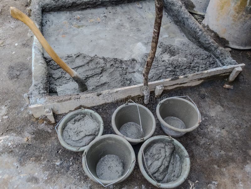Construction Site with Concrete Mixing Buckets and Tools in Outdoor ...