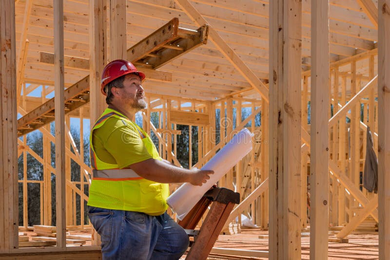 On Construction Site, a Construction Engineer Checks Quality of Wooden ...