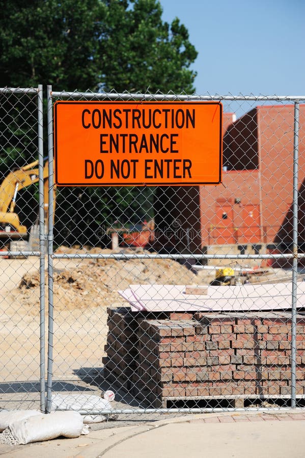 Construction Site with Construction Material, Iron Fence and Warning ...
