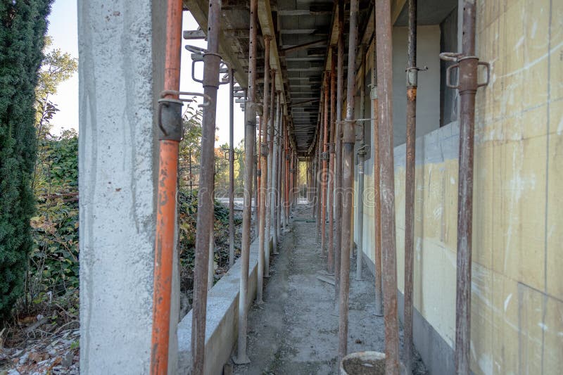 A Construction Site Corridor Supported by Metal Scaffolding, Showing ...