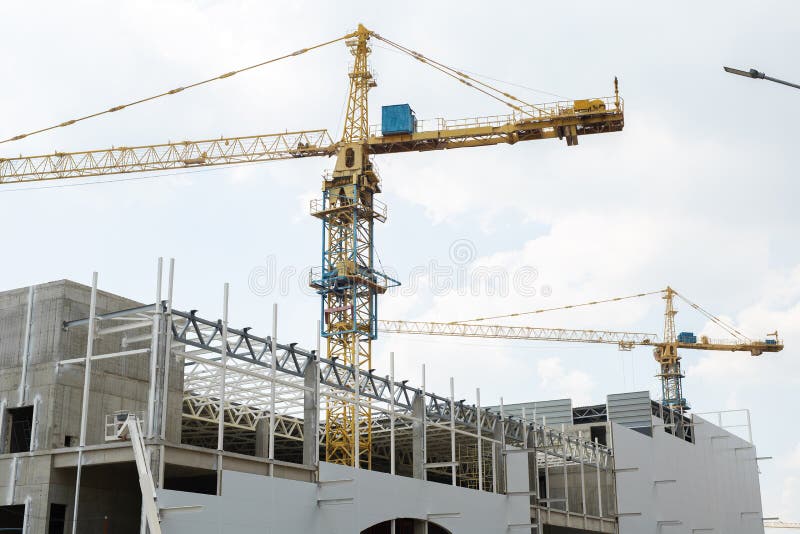 Construction Site with Crane and Building. Construction of a ...