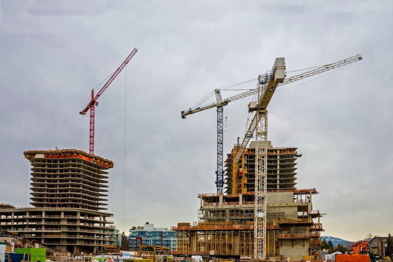 Construction Site with Cranes on the Background of Gray Sky Stock Image ...