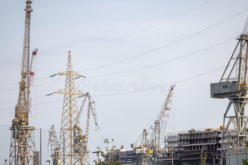 Construction Site with Cranes and Power Lines Stock Photo - Image of ...