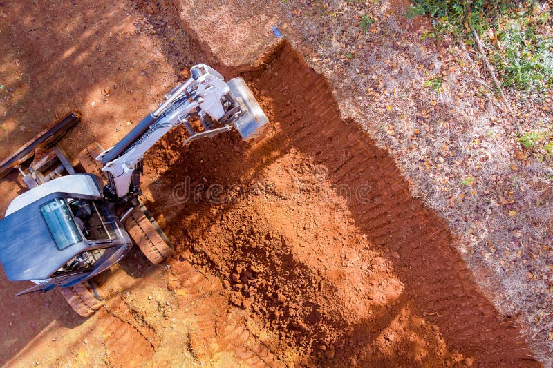 In this Construction Site, a Crawler Excavator Bucket Digging the ...