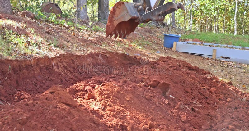 In this Construction Site, a Crawler Excavator Bucket Digging the ...