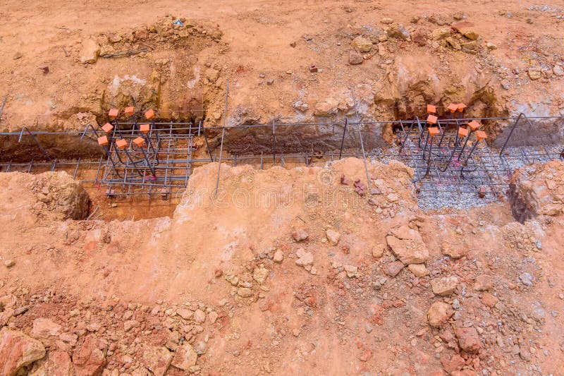 Construction Site Displaying Foundation Preparation with Rebar and ...