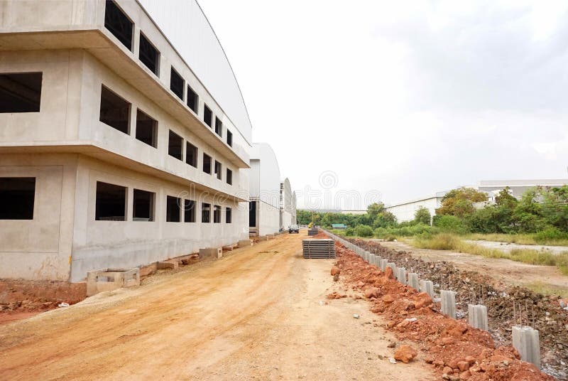 Construction Site : Driven Piles for Fence Around Office Warehouse ...