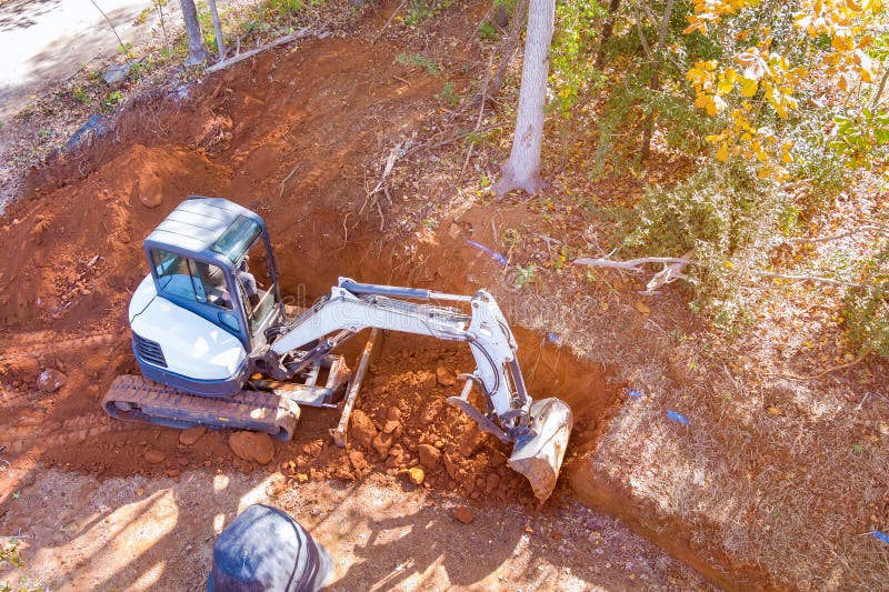 In a Construction Site during the Earthmoving Works, Crawler Excavators ...