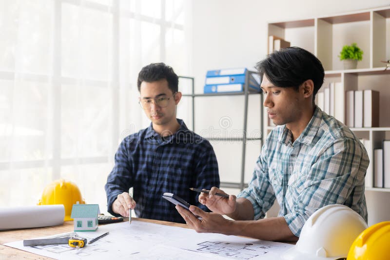 Construction Site Engineers, Two Businessmen Engineering Objects in ...