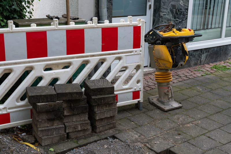 Construction Site Equipment Near Stacked Blocks and Safety Barrier ...