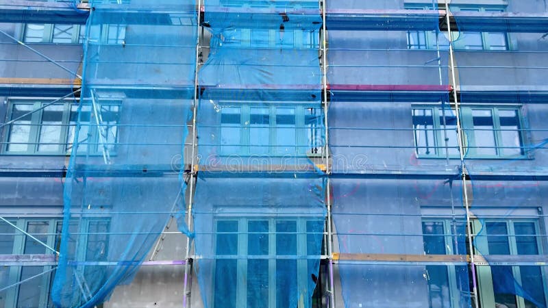 The Construction Site is Equipped with Blue Safety Netting and ...