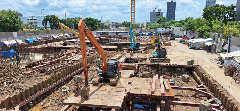 Construction Site with Excavator and Building Development in Progress. Editorial Image - Image ...