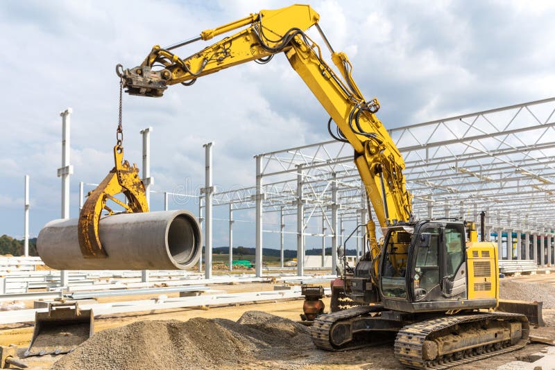 Construction Site Excavator with a Concrete Pipe Stock Photo - Image of ...