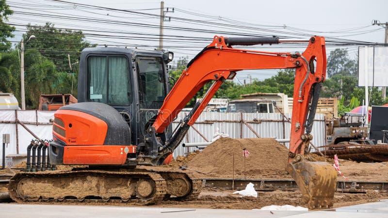 Construction Site Excavator Front View of Crawler Excavator Digs in the ...