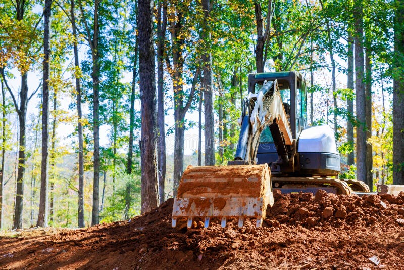 On Construction Site, an Excavator is Working To Prepare Ground for ...