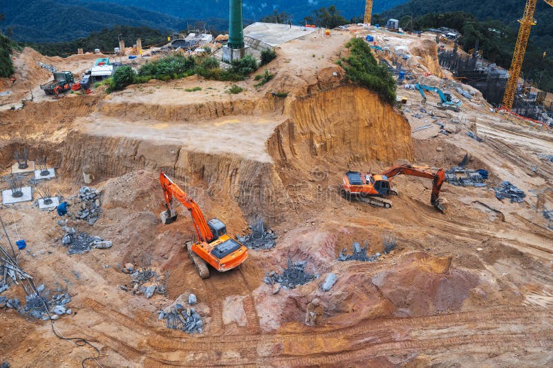 Construction Site with Excavators Digging a Pit for Foundation of a ...