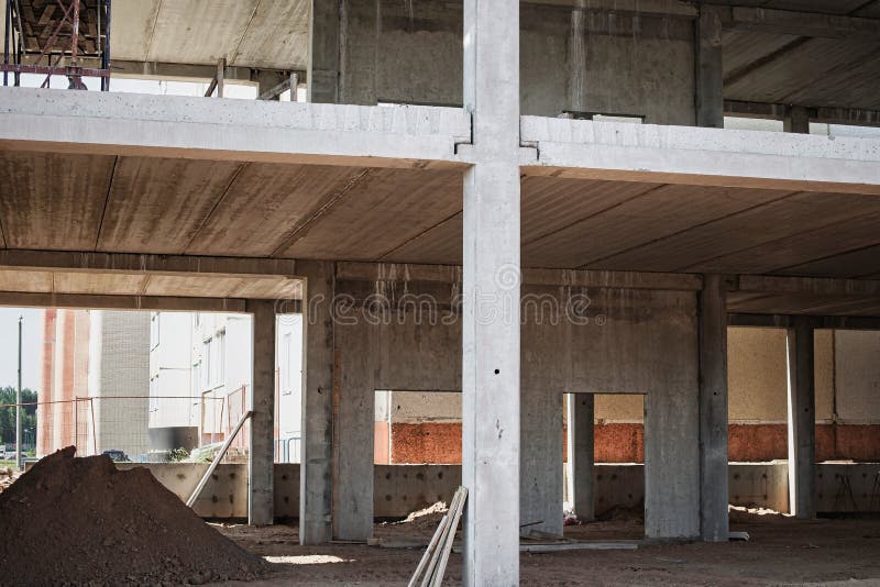 Construction Site with Exposed Concrete Structure and Building ...