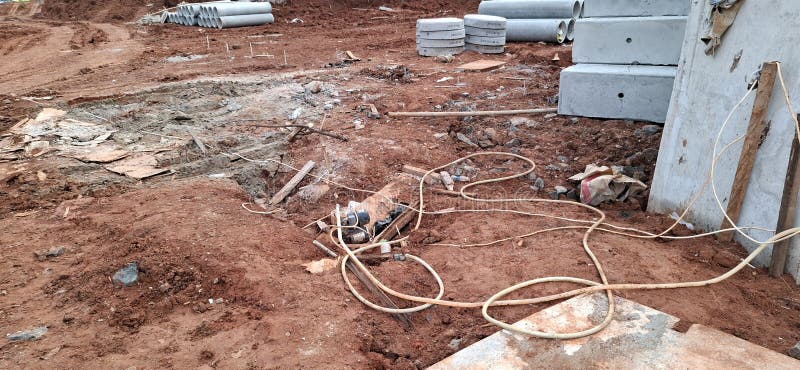 Construction Site with Exposed Electrical Wiring and Drainage Work ...
