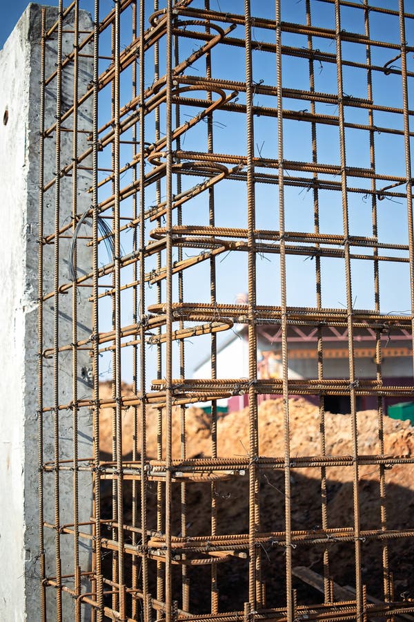 Construction Site Features Steel Rebar Framework Against a Clear Blue ...