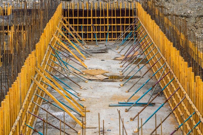 Construction Site with Wooden Formwork and Metal Rebar Outdoors with ...