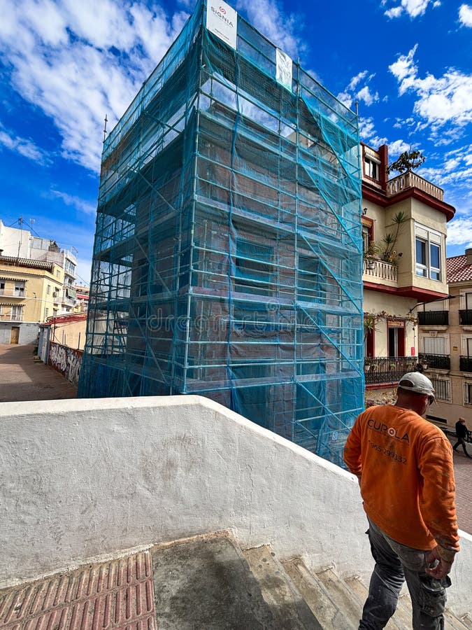 Construction Site Featuring a Blue Scaffolding Structure Against a ...