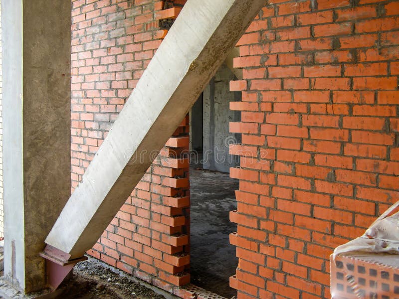 Construction Site Featuring a Brick Wall and Reinforced Concrete Column ...