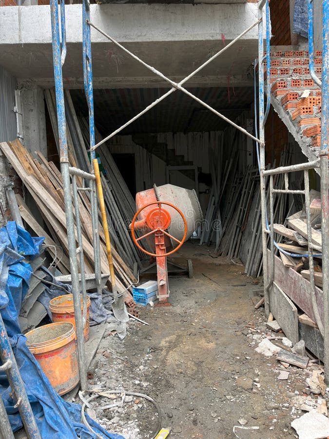 Construction Site Featuring a Concrete Mixer Surrounded by Construction ...
