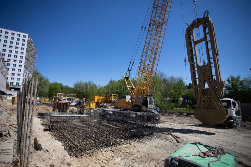 A Construction Site Featuring Heavy Machinery, Equipment, and a Tall ...