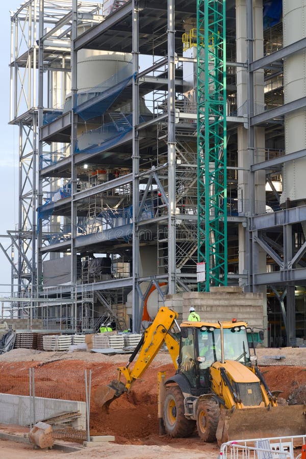 Construction Site Featuring Heavy Machinery and Visible Steel Framework ...