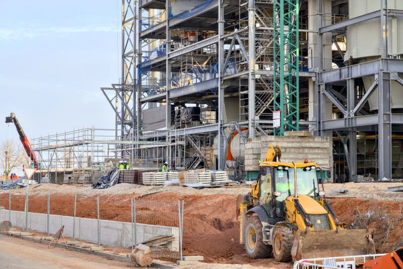 Construction Site Featuring Heavy Machinery and Visible Steel Framework ...