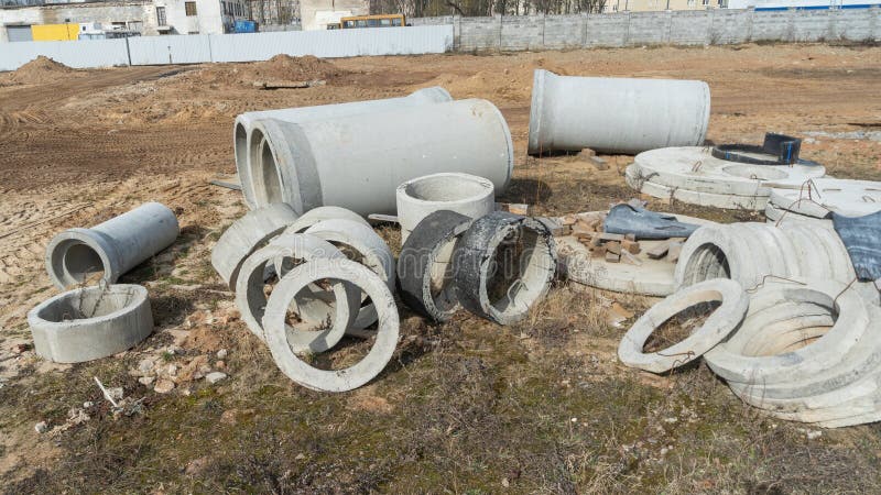 A Construction Site Featuring Various Diameters of Concrete Pipes ...