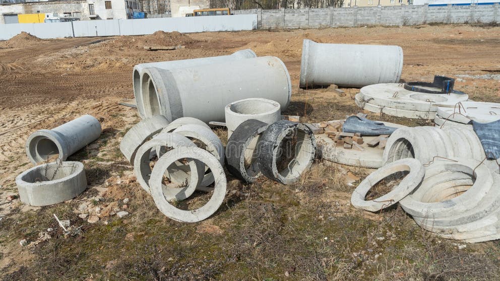 A Construction Site Featuring Various Diameters of Concrete Pipes ...