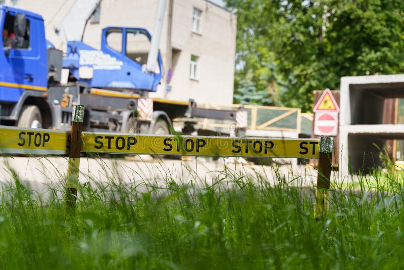 Construction Site Fencing with Yellow Tape with Stop Sign. Stock Photo ...