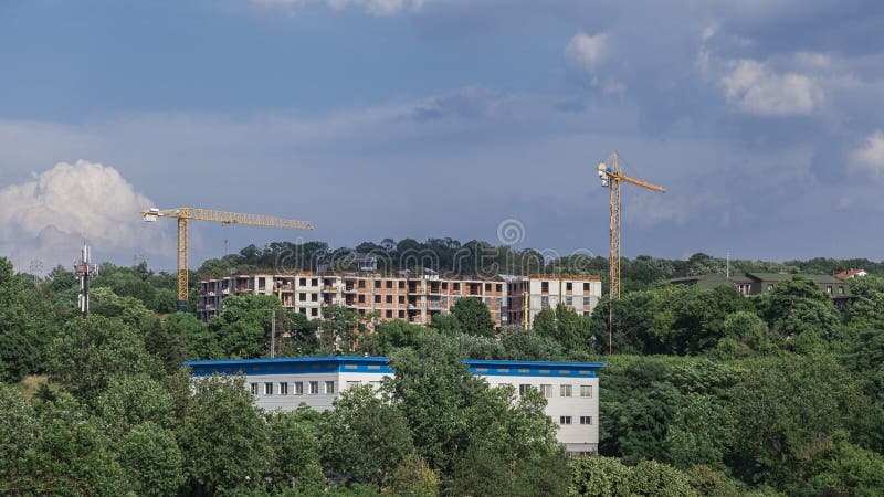 Construction Site in the Forest with Heavy Cranes. Stock Photo - Image ...