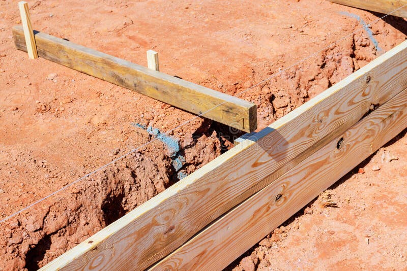 Construction Site during Foundation Laying Showing Dirt and Wooden ...