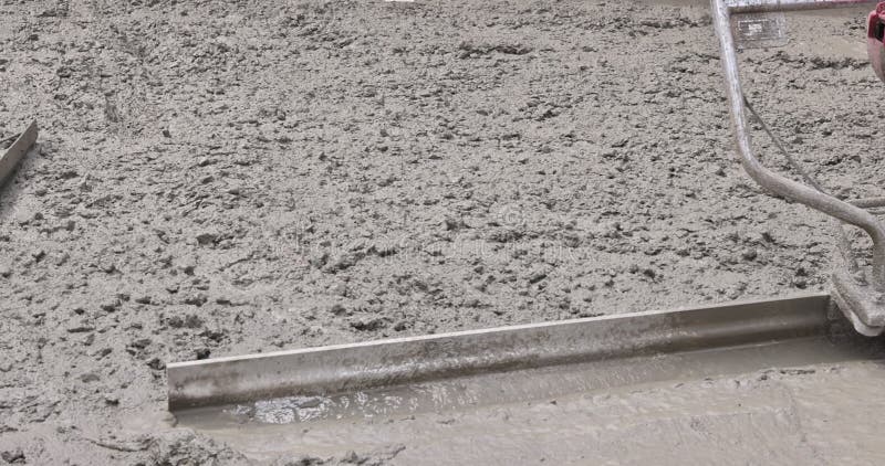 On Construction Site, Fresh Concrete is Tamped Using Compactor Rammer ...