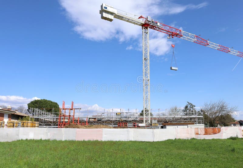 Construction Site in Front of a Grass Field with Plastic Fence ...