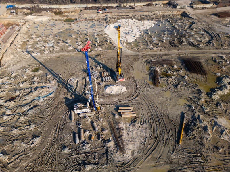 A Construction Site with Heavy Machinery Drilling and Preparing ...