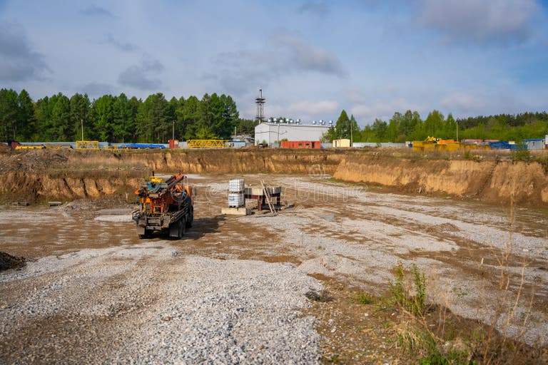 Construction Site with Heavy Machinery Preparing Foundation for Future ...