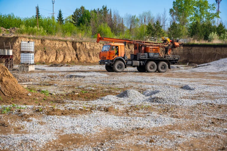 Construction Site with Heavy Machinery Preparing Foundation for Future ...