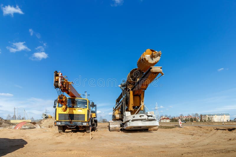 The Construction Site for the Highway with Heavy Equipment. Two ...