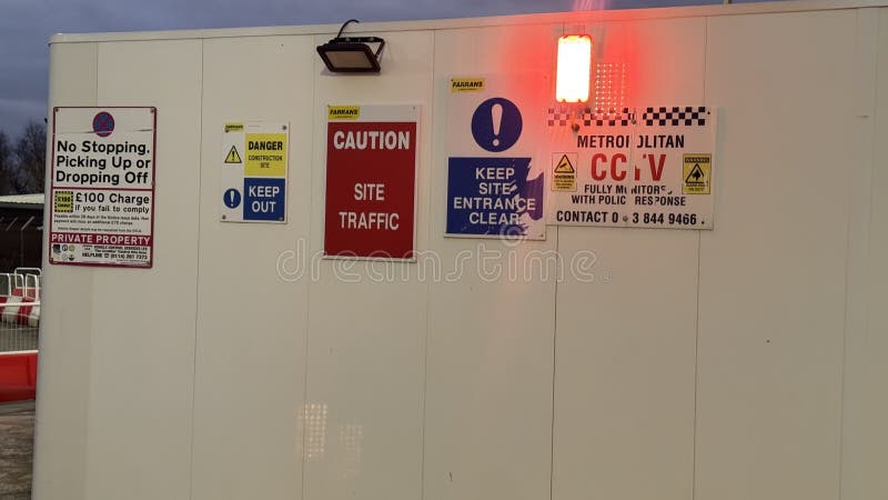 Construction Site Hoarding with Warning Signs and CCTV Information ...